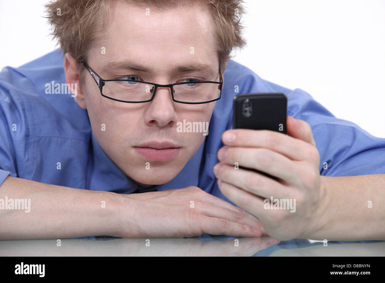 Lonely man waiting for the phone to ring Stock Photo - Alamy