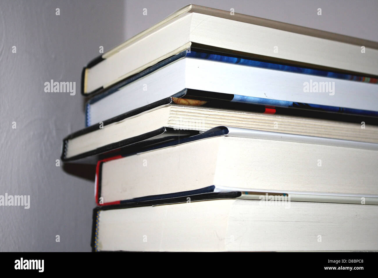 A stack of books represents knowledge, learning, and organization ...