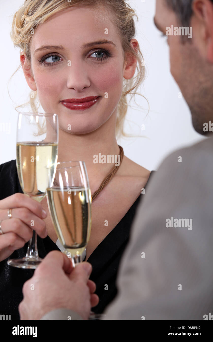 Elegant couple drinking champagne Stock Photo - Alamy