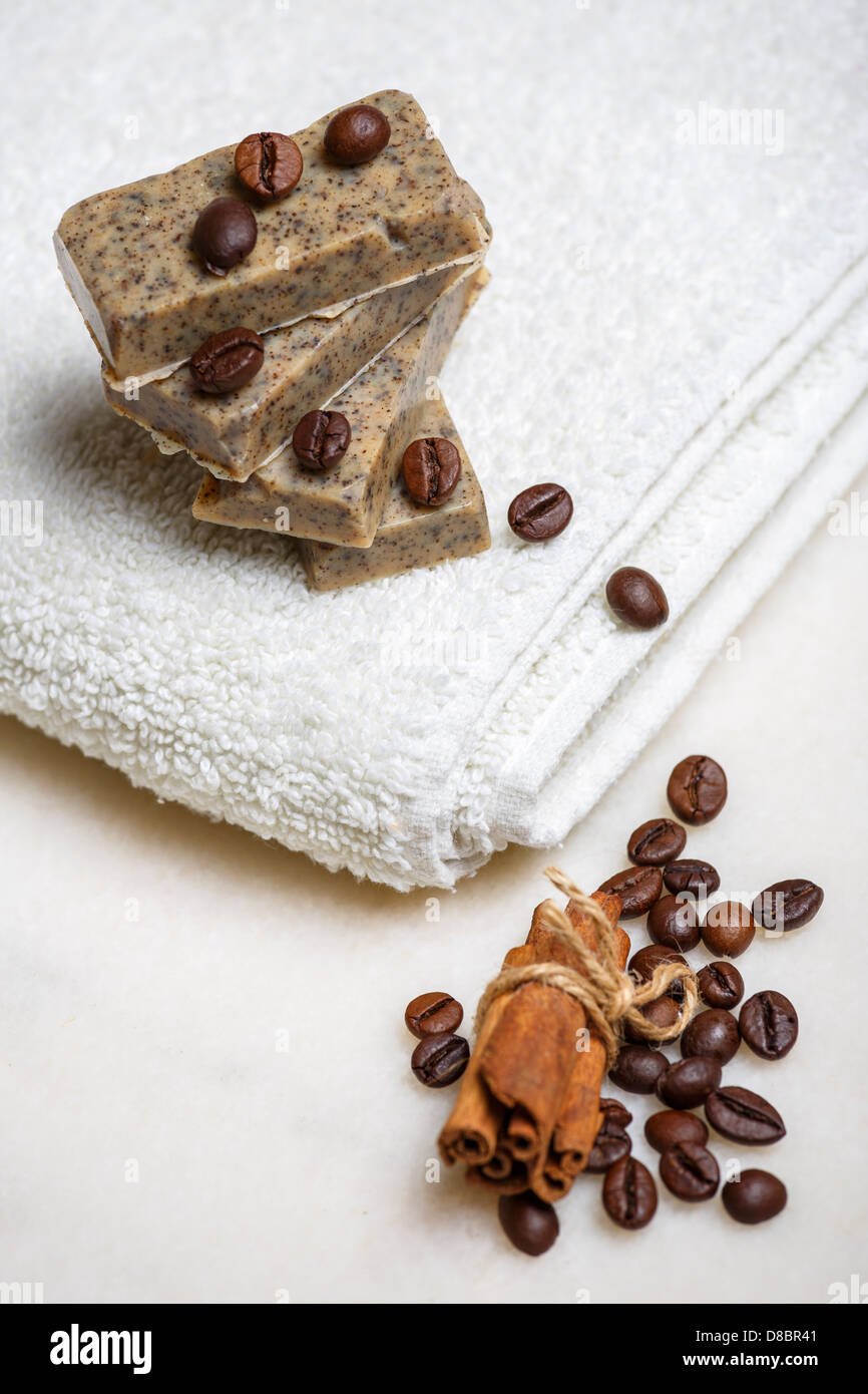 Stack of handmade flavored soap bars surrounded by coffee beans and ...