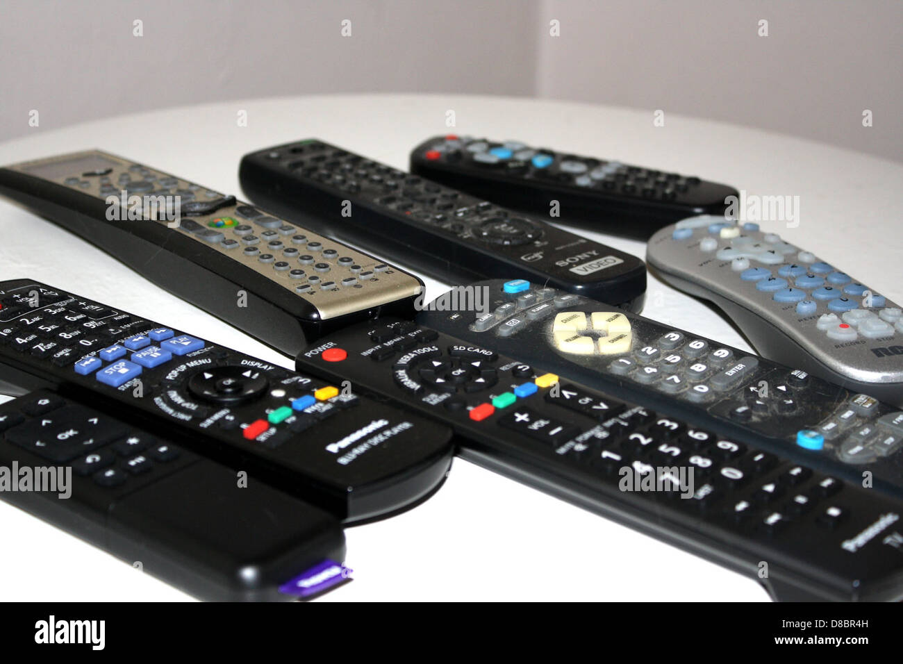 table top covered with remote controls Stock Photo - Alamy