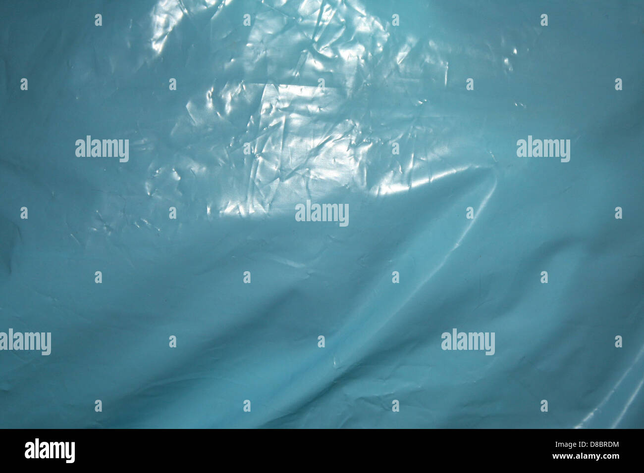 Close-up of a teal plastic texture, showing the smooth surface and ...