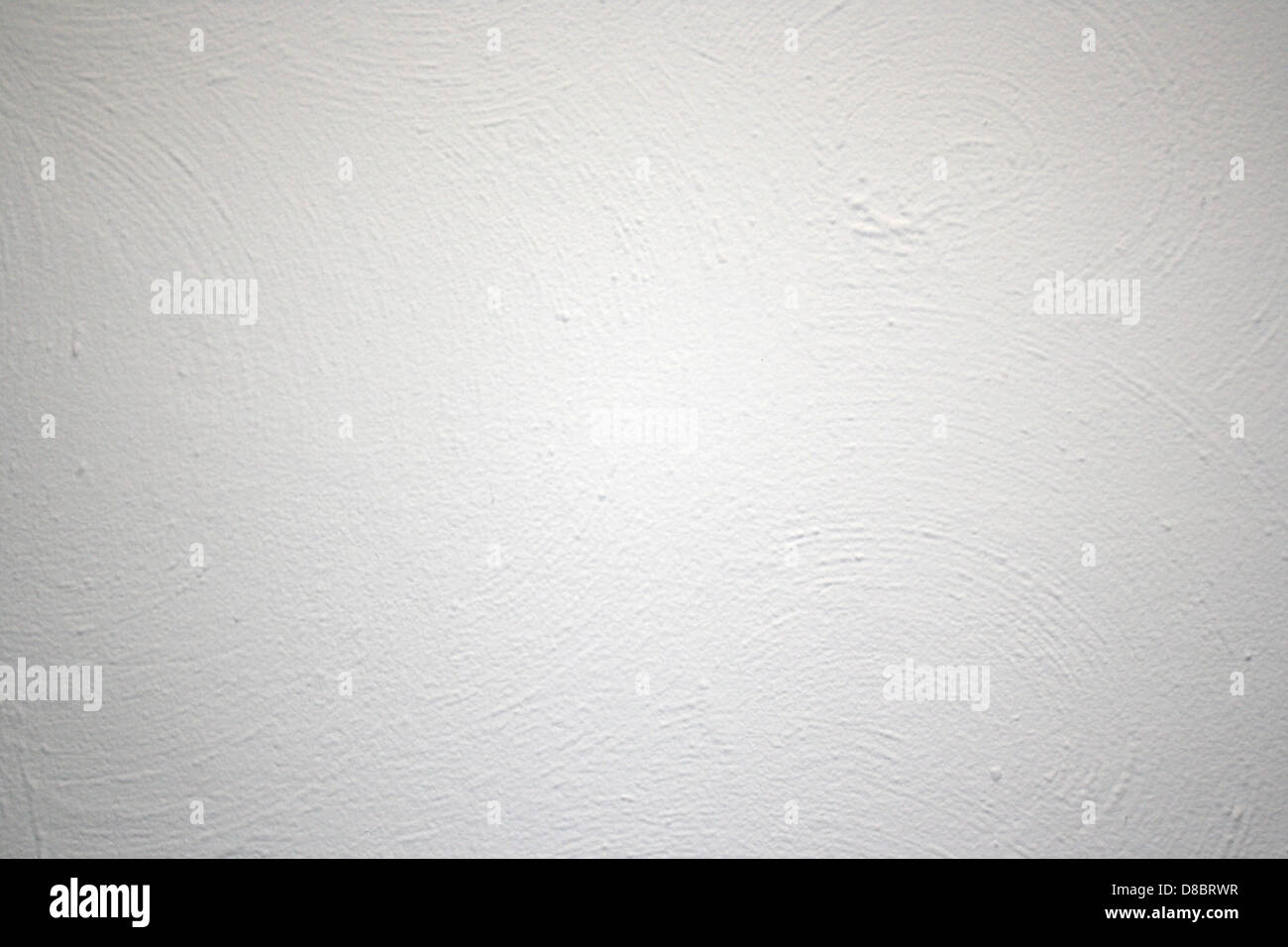 A close-up of textured ceiling plaster shows its uneven surface and ...