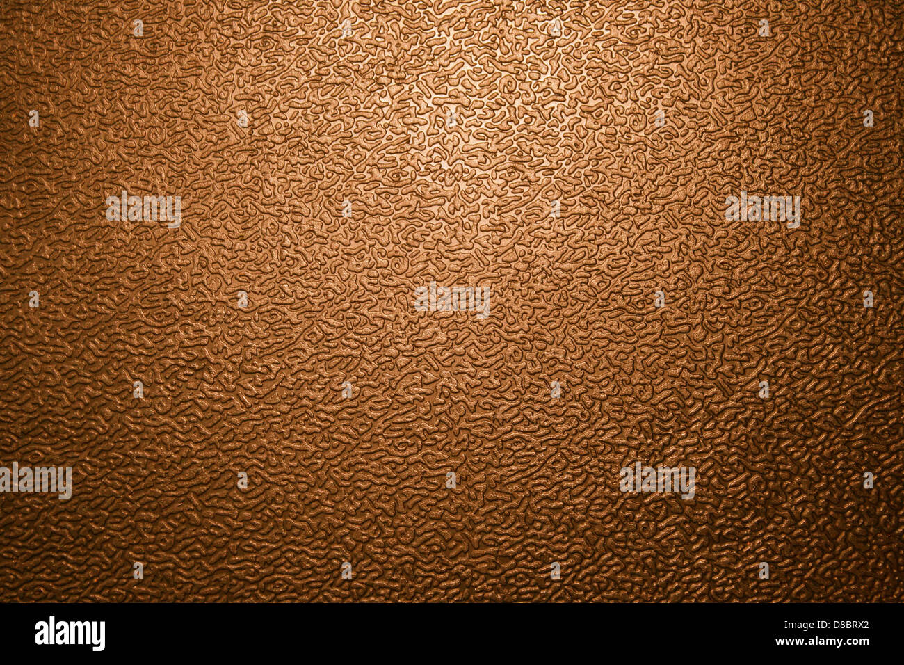 A close-up view of textured brown plastic, showing the fine details of ...