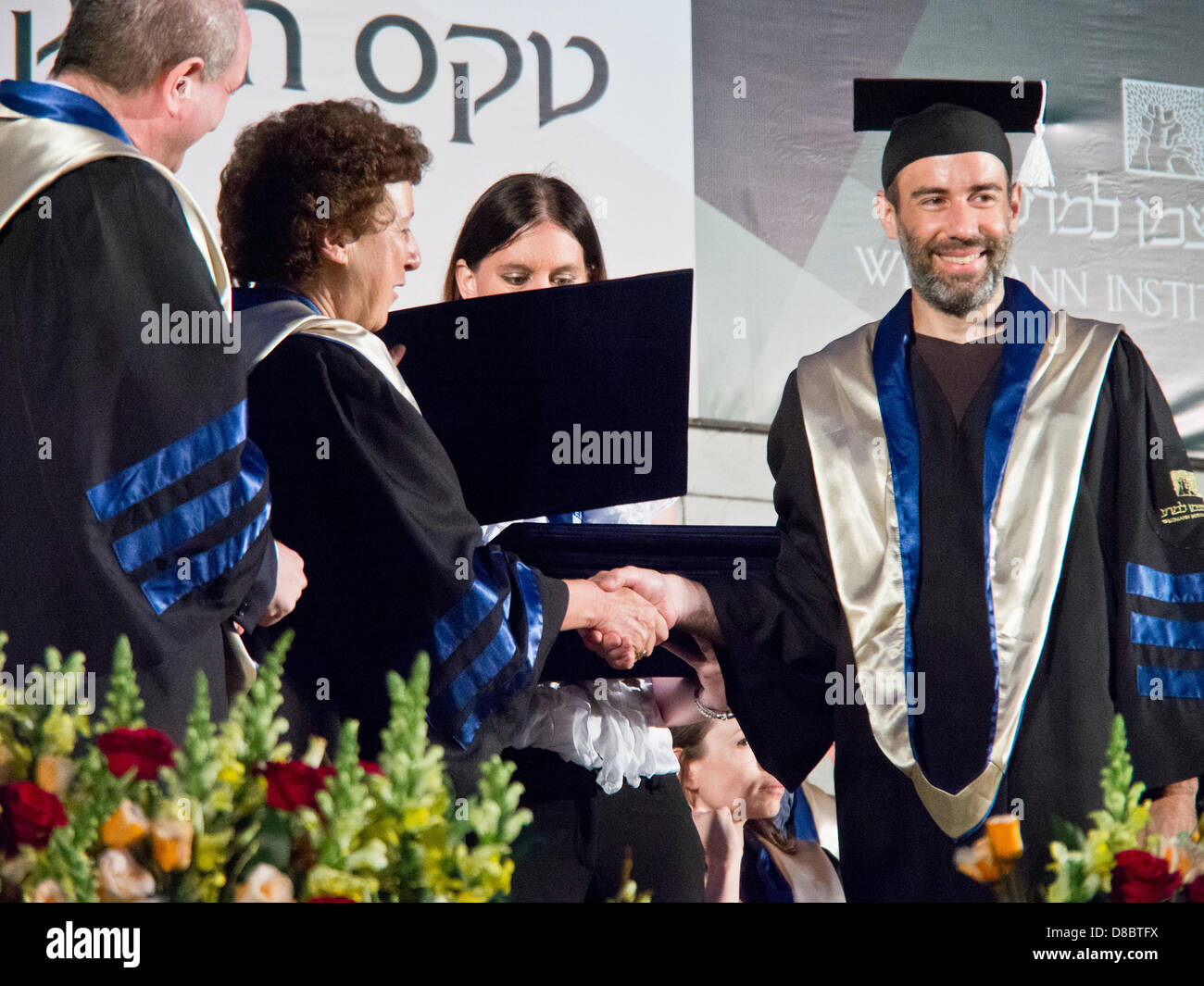 Rehovot, Israel. 23-May-2013. PhD student receives a certificate of ...