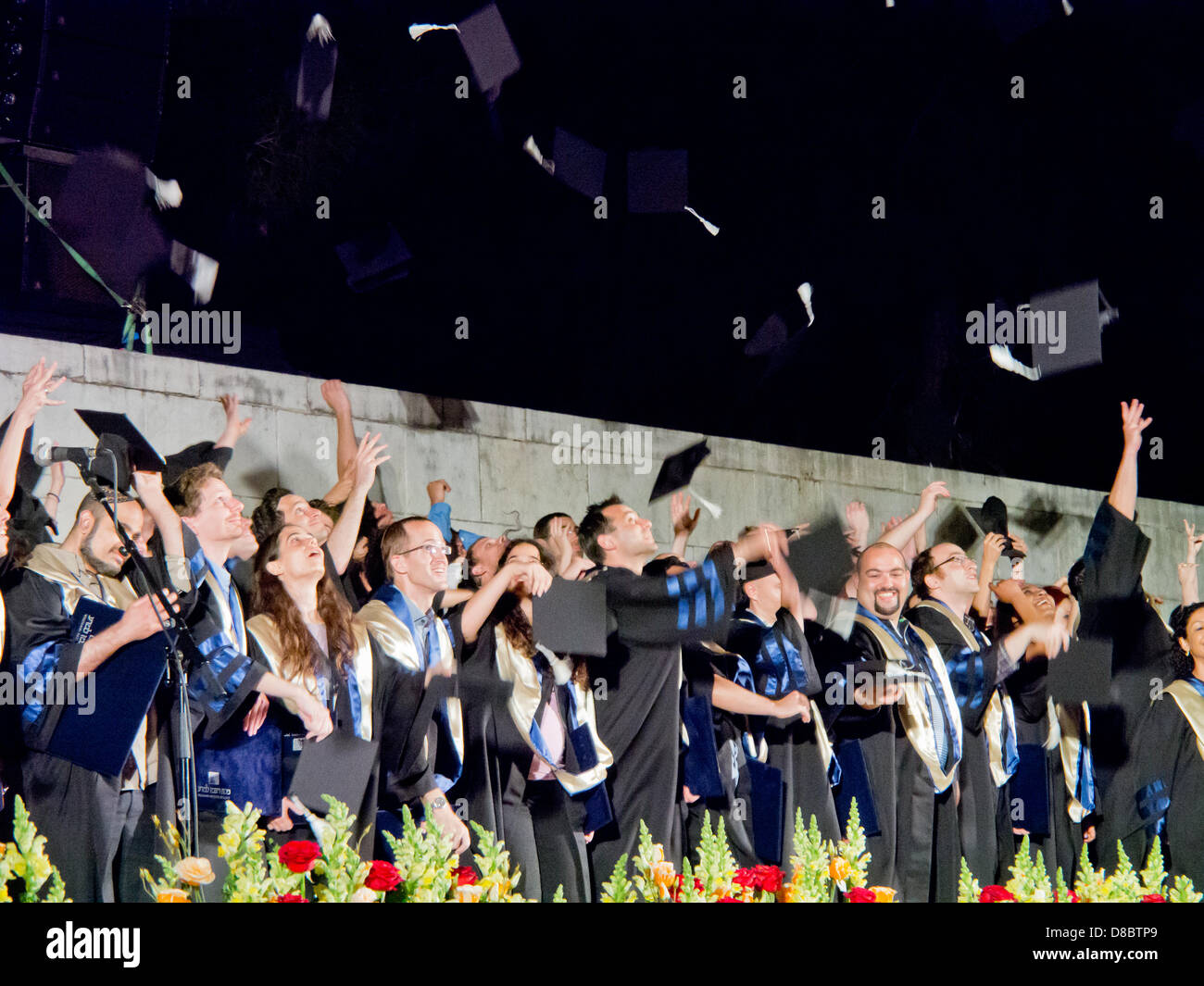 Rehovot, Israel. 23-May-2013. Masters and PhD students throw their caps ...