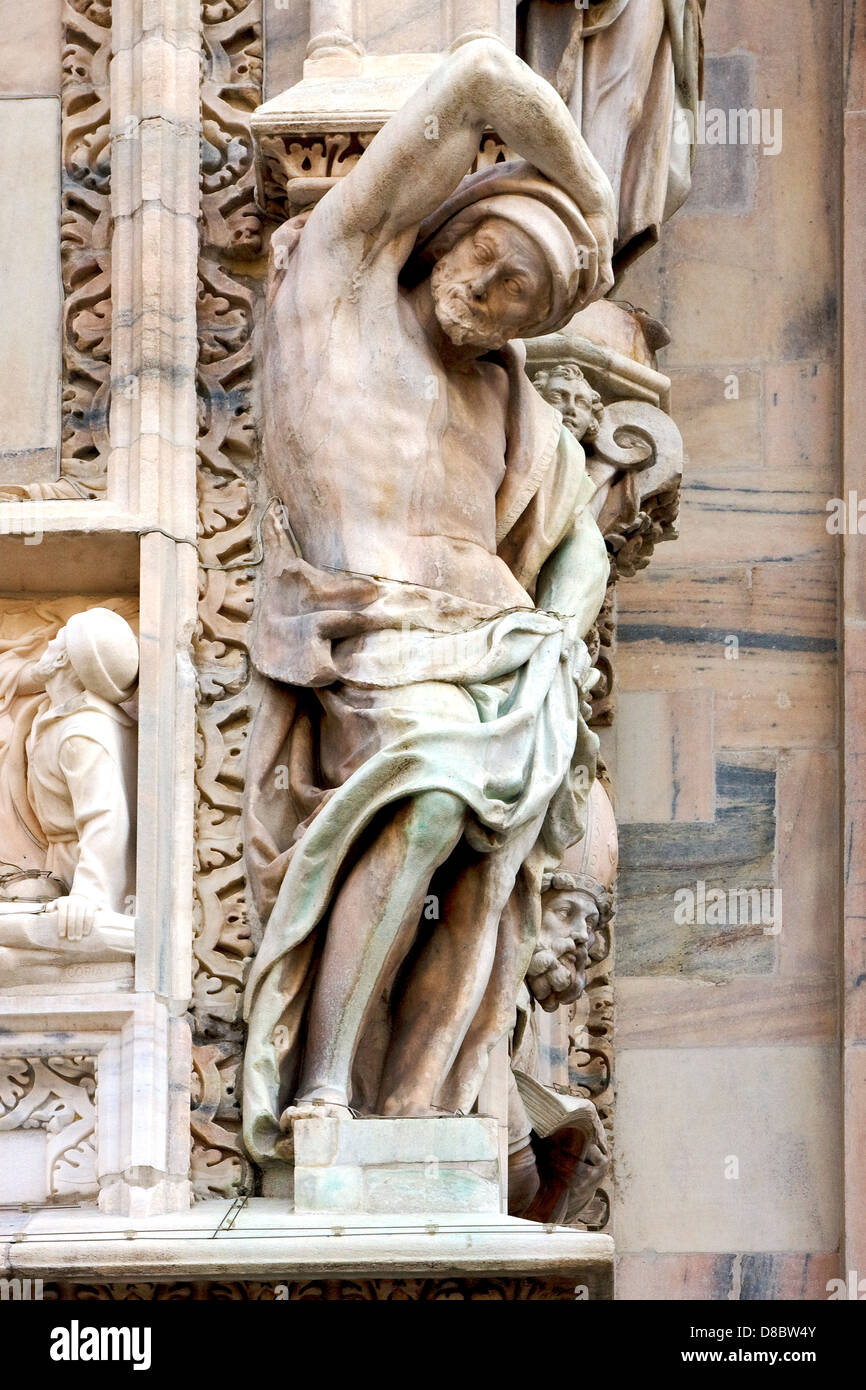italy statue of a men in the front of the duomo church in milan and ...