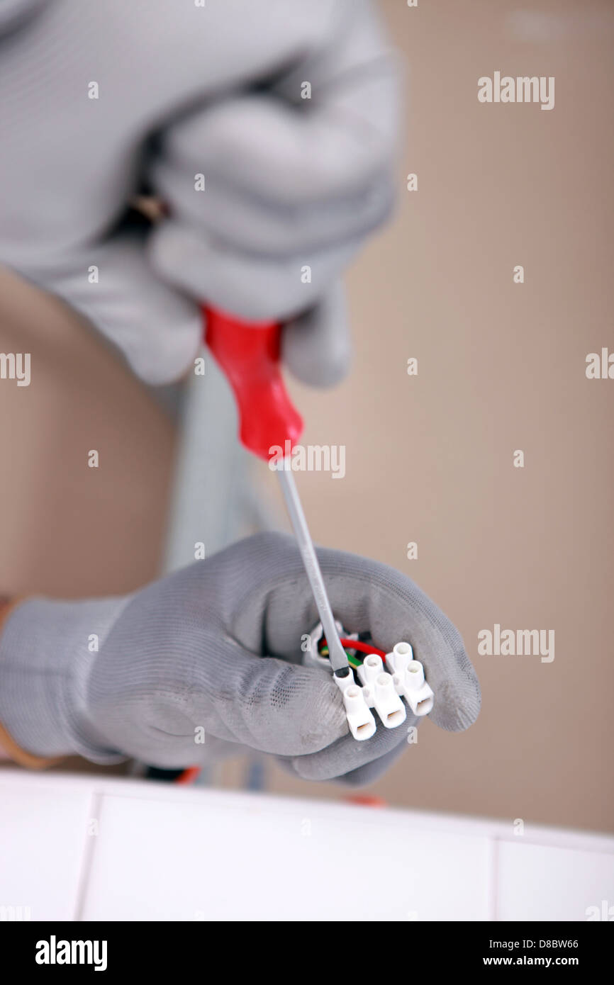 Electrician wiring a chocolate box Stock Photo - Alamy