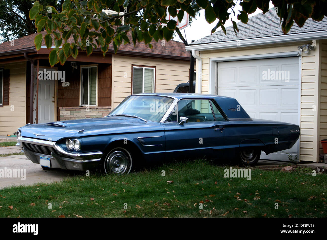 A vintage blue Thunderbird car, captured in a classic pose, showcasing ...