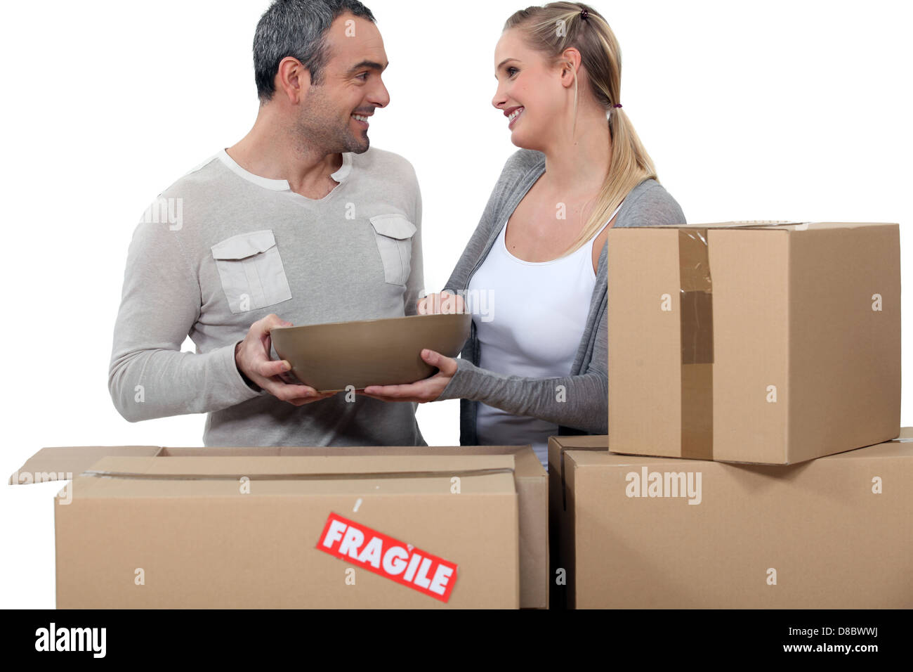 Couple moving in to new home Stock Photo - Alamy
