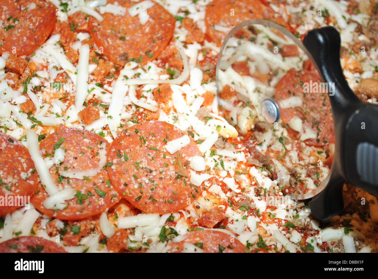 Cutting Cheesy Pepperoni Pizza Stock Photo - Alamy