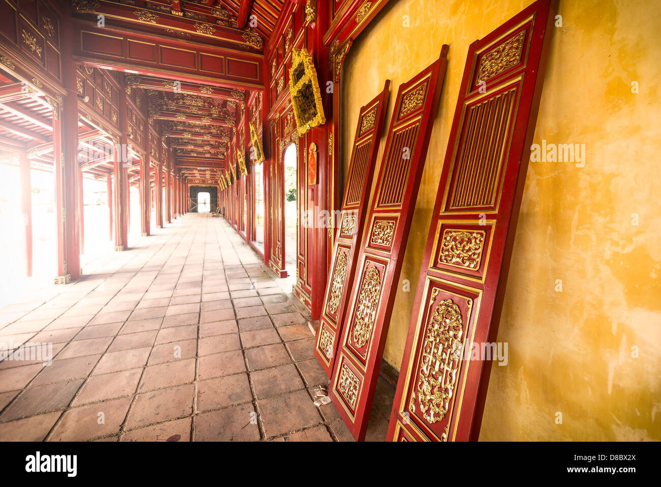 Beautiful red wooden hall with golden ornate details in Hue citadel ...