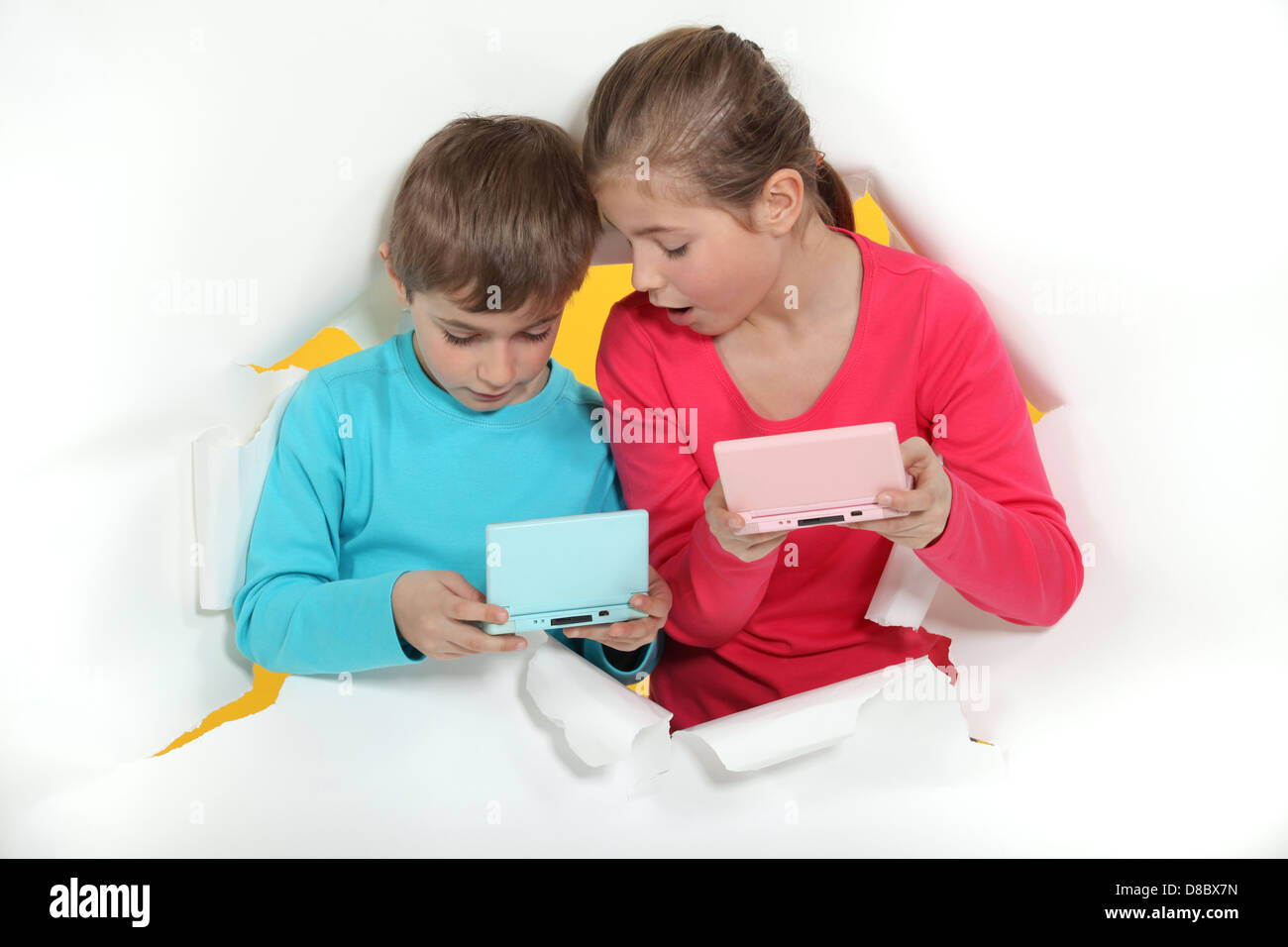 Kids with handheld computers Stock Photo - Alamy