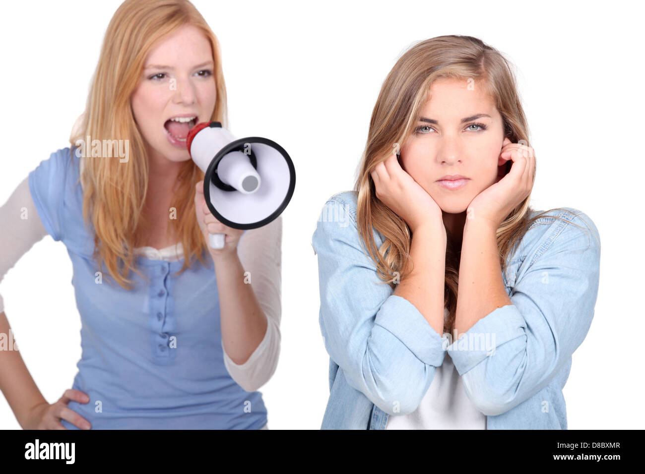 Girl shouting at friend Stock Photo - Alamy