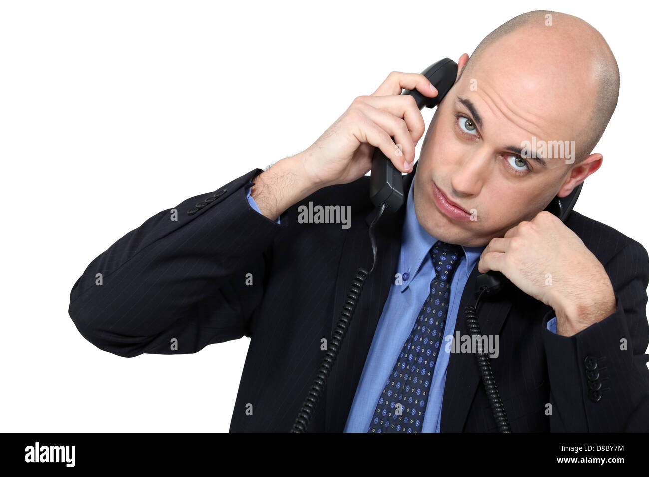 Businessman using two phones Stock Photo - Alamy