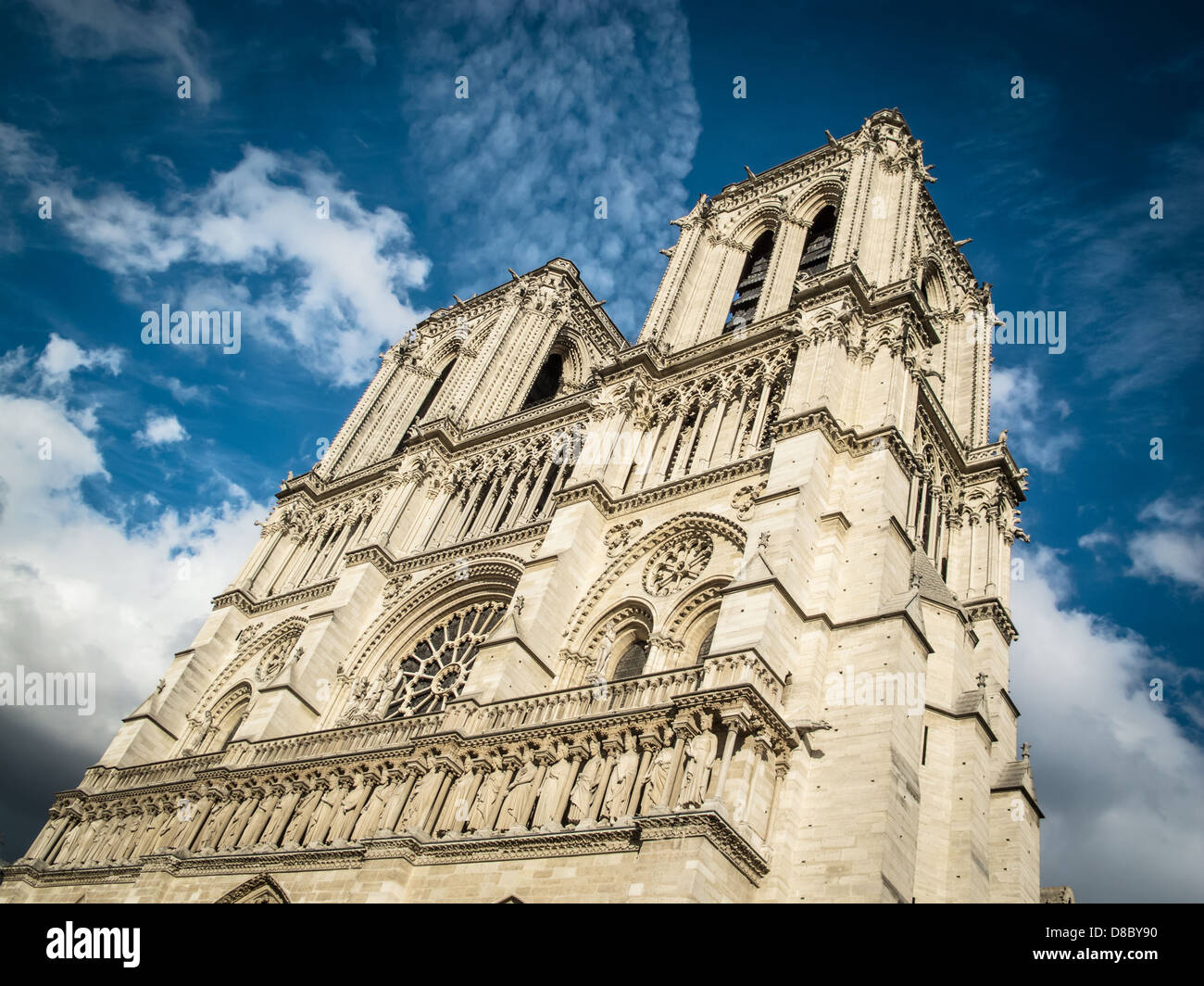 Notre Dame De Paris cathedral at sunny day. Blue sky with clouds in ...