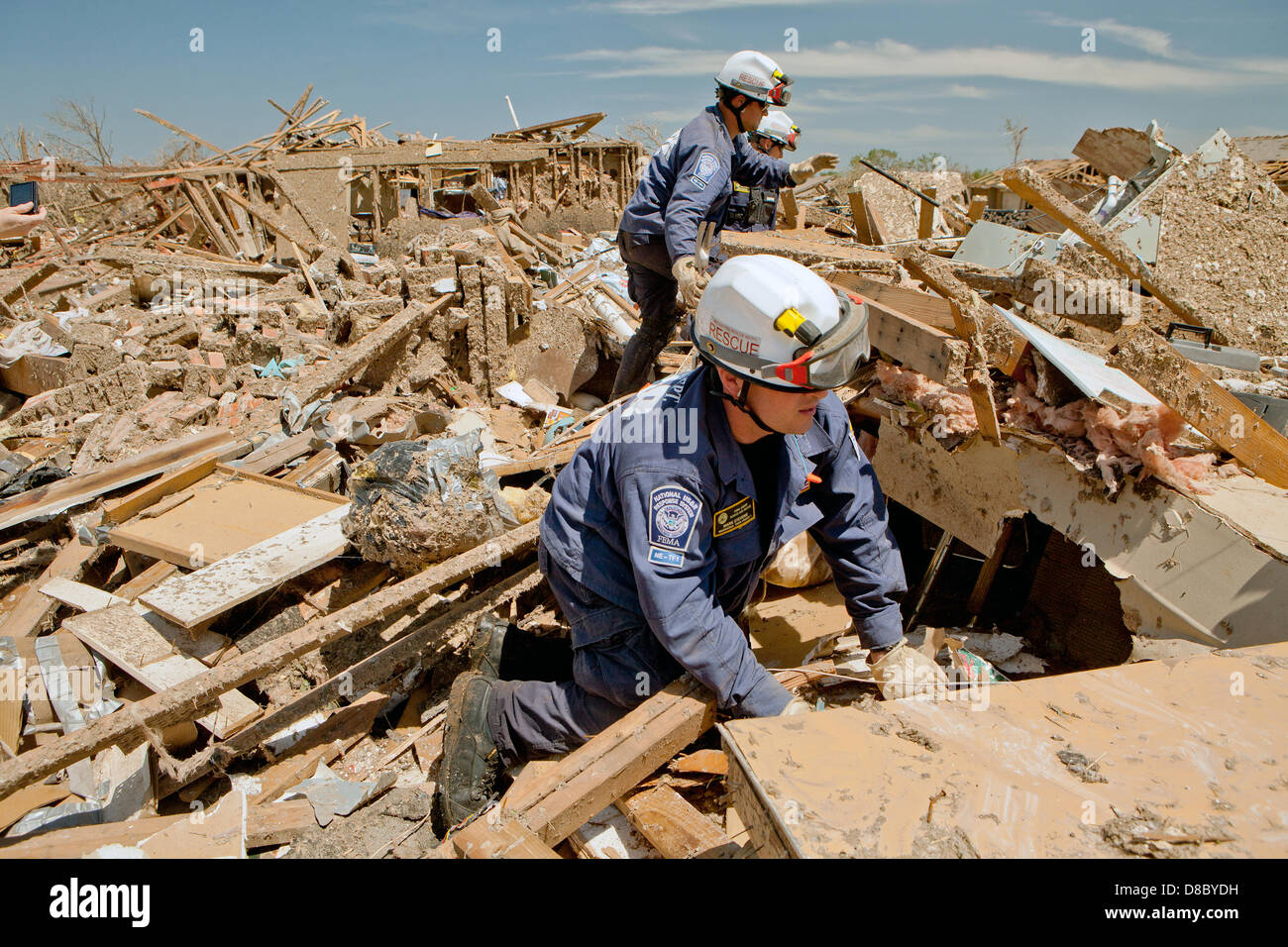 FEMA Urban Search and Rescue teams search house to house for survivors ...