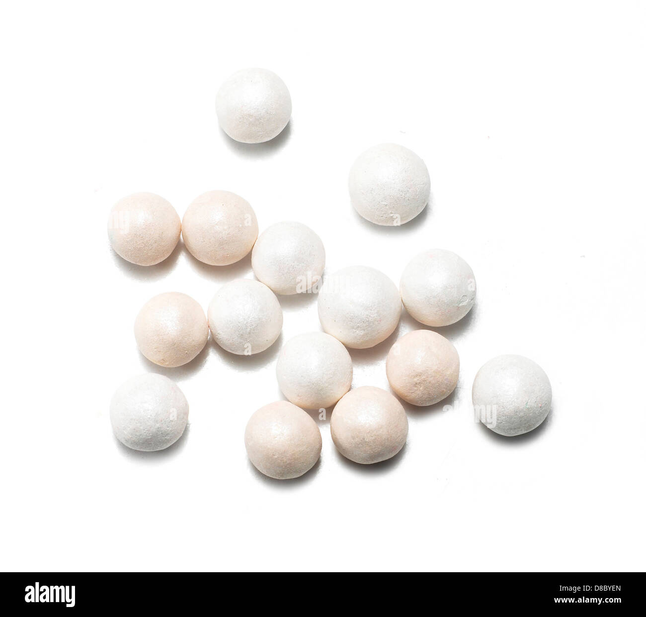 makeup powder balls cut out onto a white background Stock Photo - Alamy