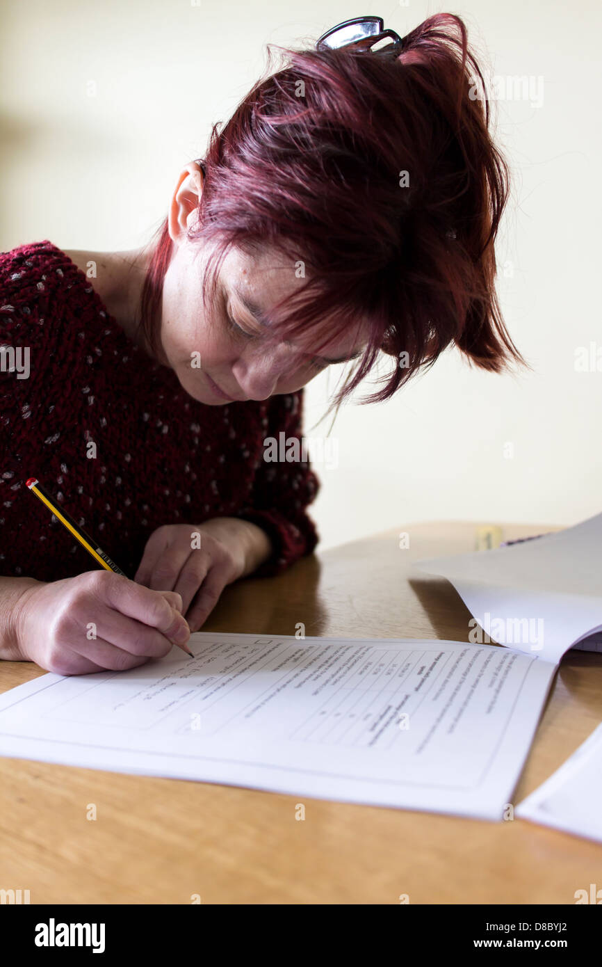 Red head female studying Stock Photo - Alamy