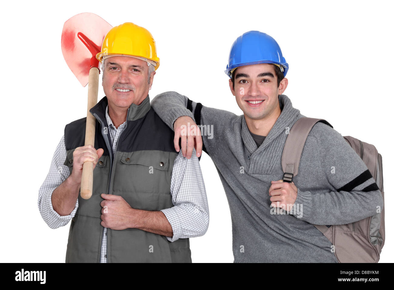 Experienced tradesman posing with his new apprentice Stock Photo - Alamy