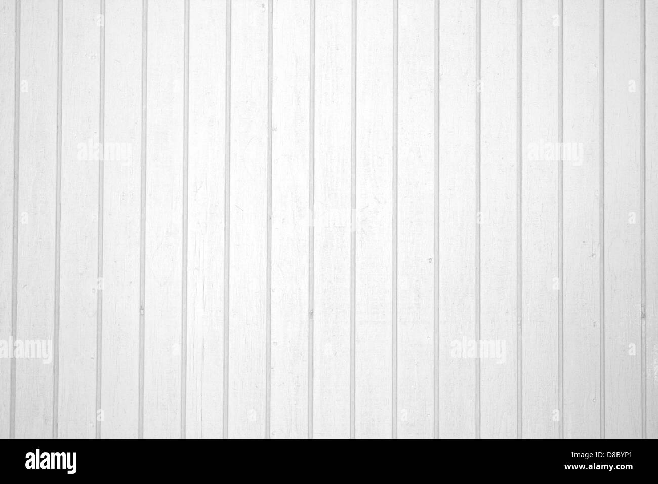 A close-up of vertical white siding texture, often used in ...