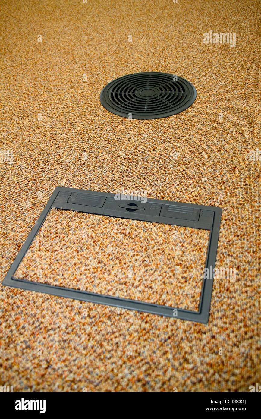Raised office flooring data outlet box and vent Stock Photo - Alamy