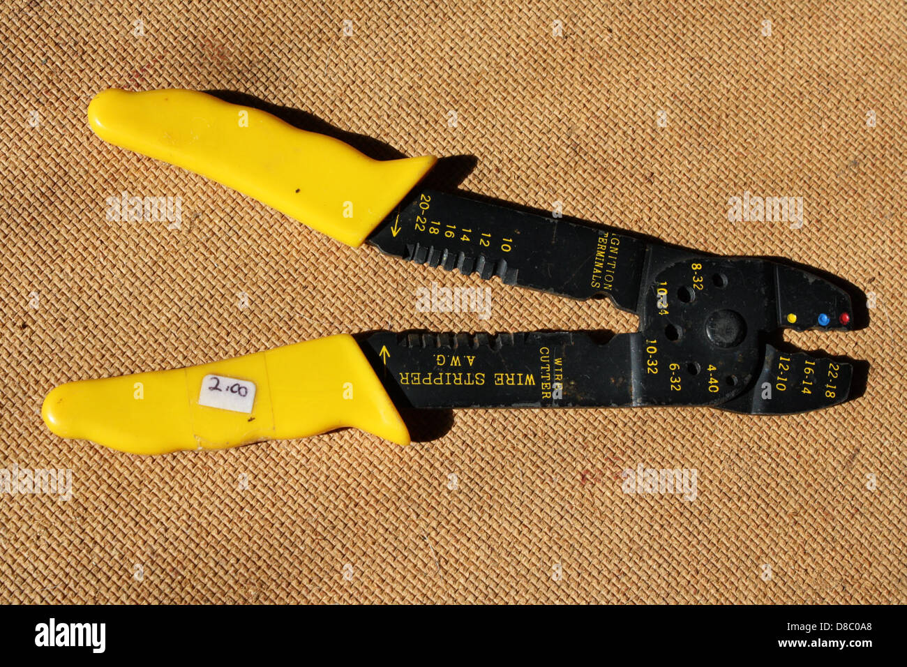 A wire stripper tool used for removing the insulation from electrical ...