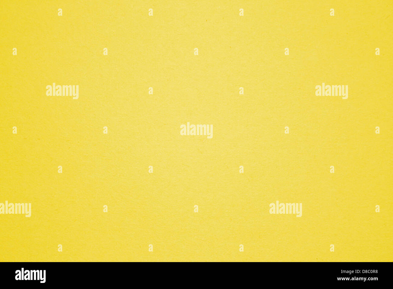 A close-up of yellow construction paper, highlighting the texture and ...
