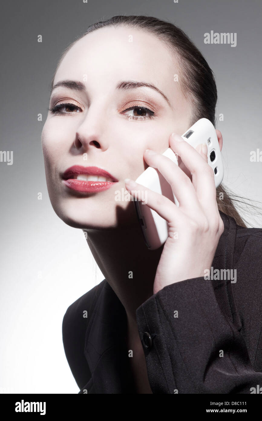 Young woman on cell phone, portrait Stock Photo - Alamy