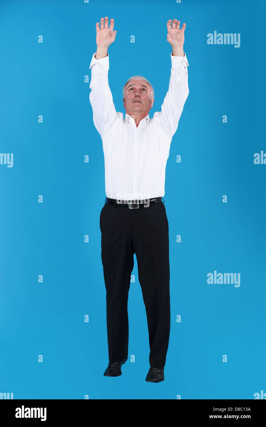Man reaching for the sky Stock Photo - Alamy
