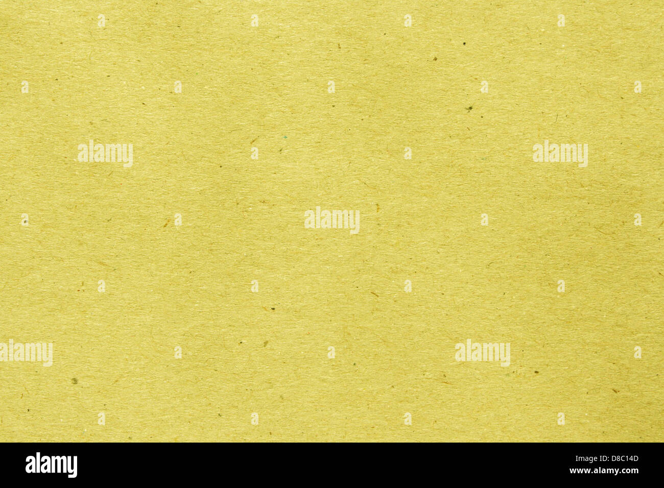 A close-up image of yellow paper featuring subtle flecks, showcasing ...