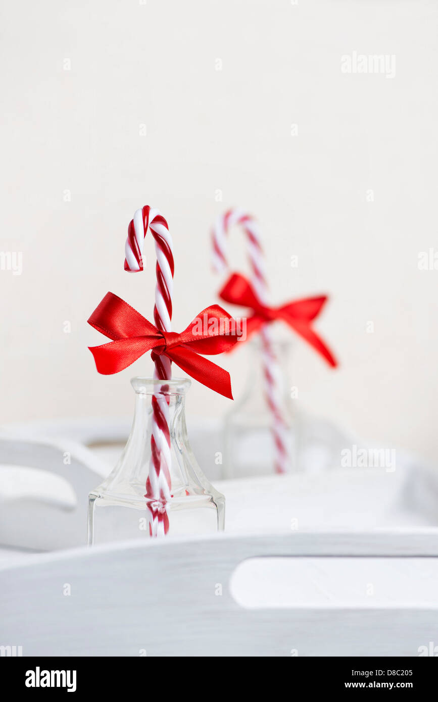 Candy canes with red ribbons Stock Photo - Alamy