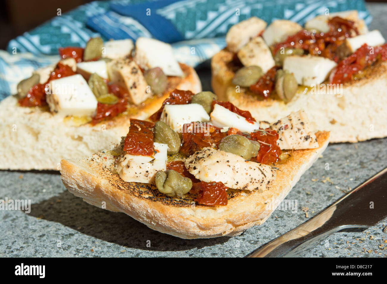 Maltese hobz-bi-zejt (bread brushed with olive oil, toasted and topped ...