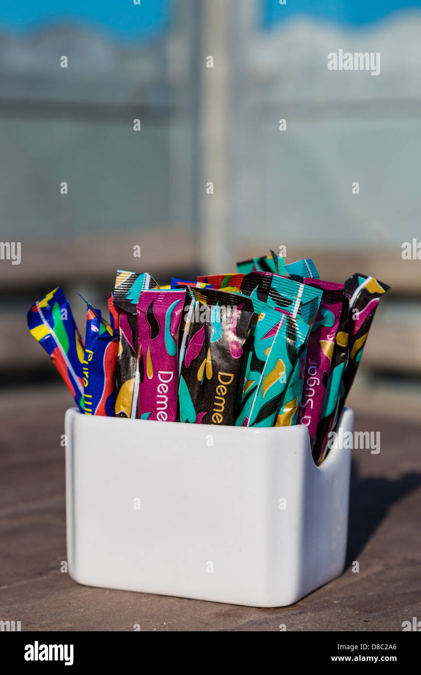 Pot of sugar packets on a table Stock Photo - Alamy