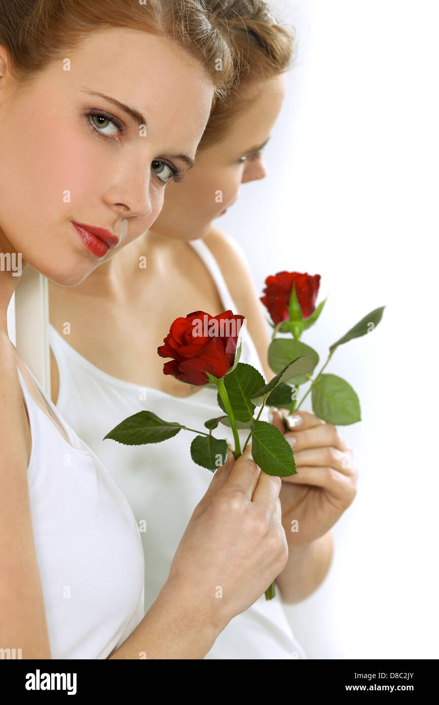 Woman with a rose in hand Stock Photo - Alamy