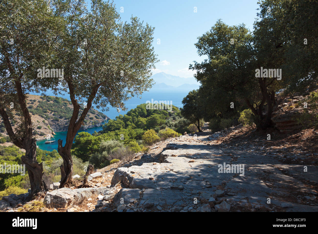 Footpath to the ruins of ancient Lydae with a gulet moored in Ag Limani ...