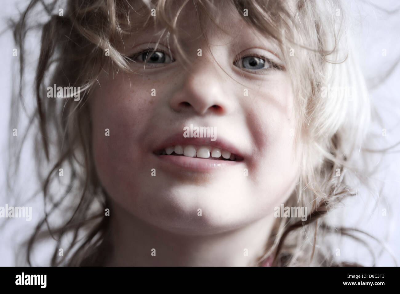 Girl smiling at camera Stock Photo - Alamy