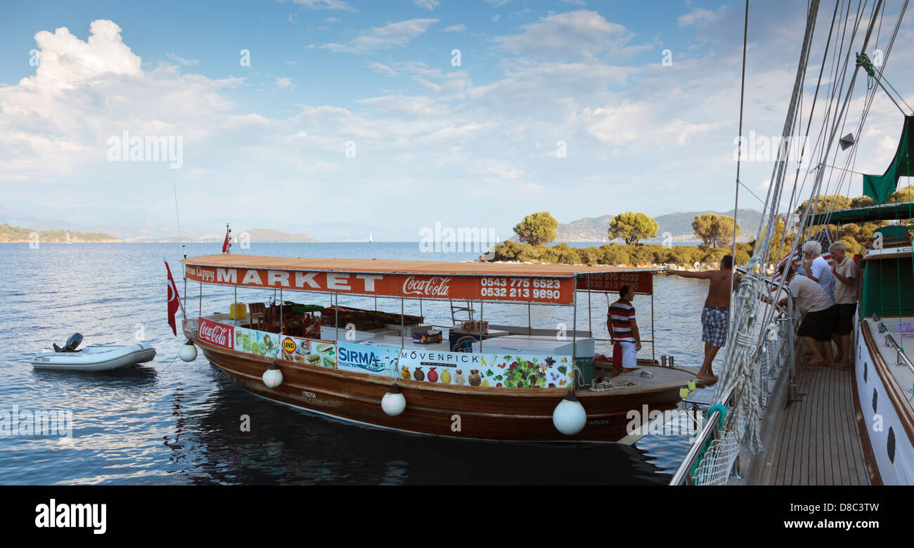Floating shop near Gocek Turkey in the Gulf of Fethiye makes a sale to ...