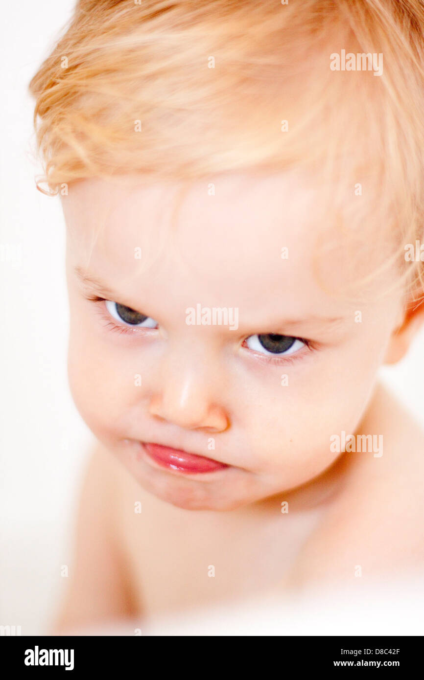 Toddler pulling a face Stock Photo - Alamy