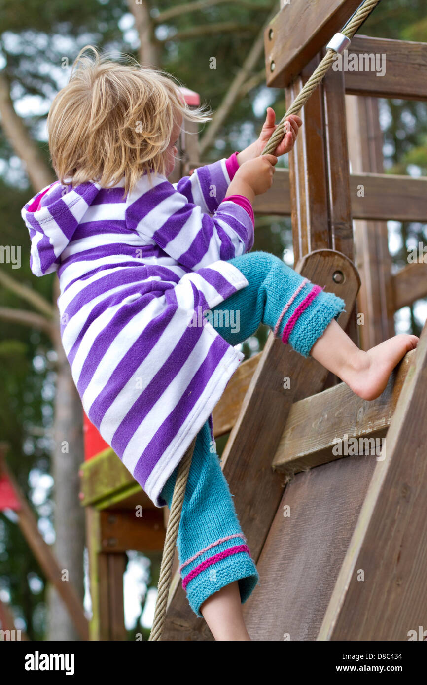Girl climbing on playground Stock Photo - Alamy