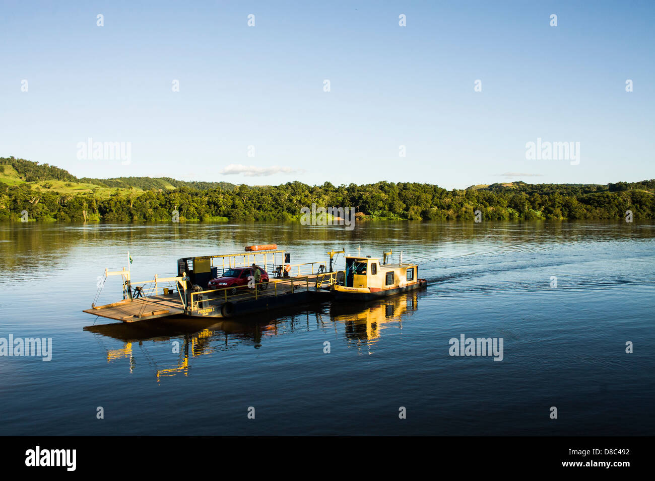 Ferry boat that transports people and vehicles through the border ...
