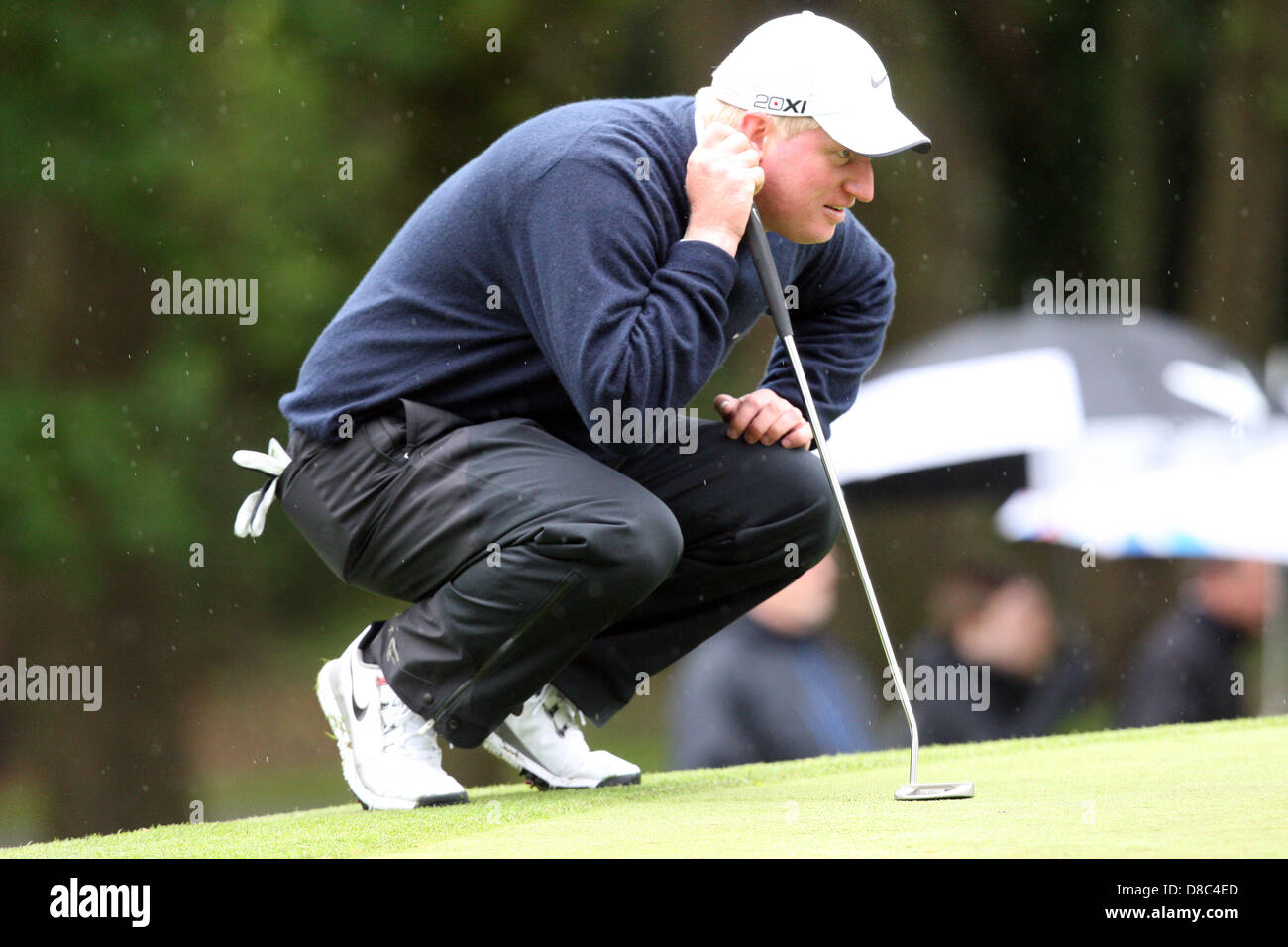 24.05.2013 Wentworth, England. Richard Finch looks over a putt during ...