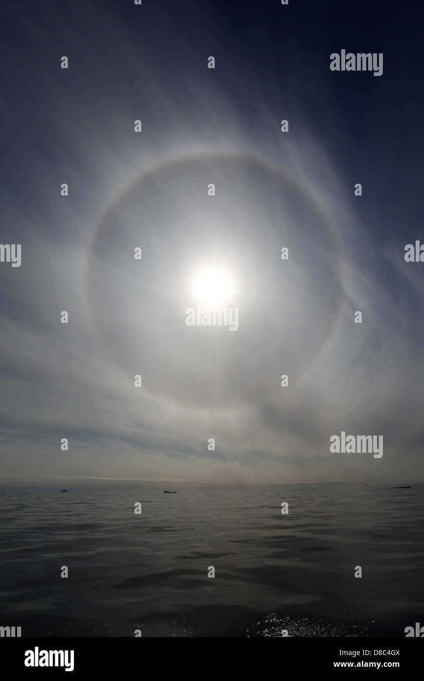 Corona of the sun over the sea, Tasiilaq, East Greenland Stock Photo ...