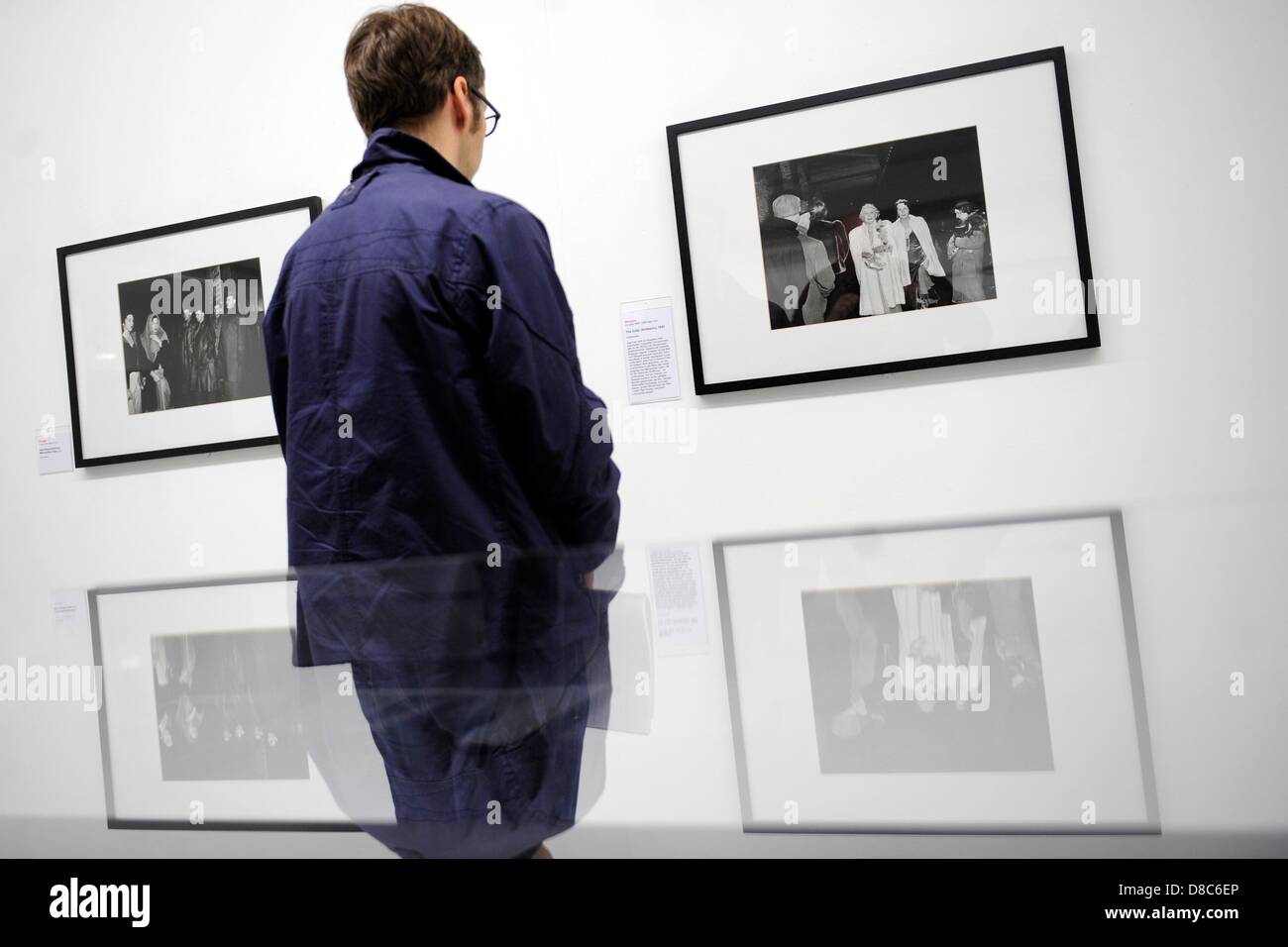 A journalist looks at the photo "The Critic" by American photographer ...