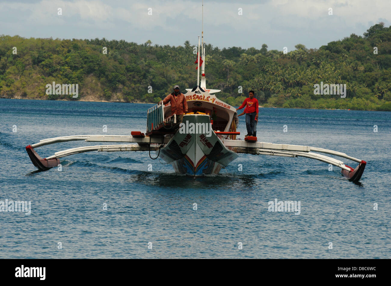 A passenger boat in the port of Puerto Galera. Mindoro Island ...