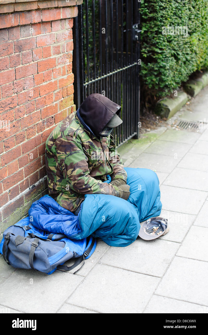 homeless man sitting down begging for money on the Streets of Salisbury ...