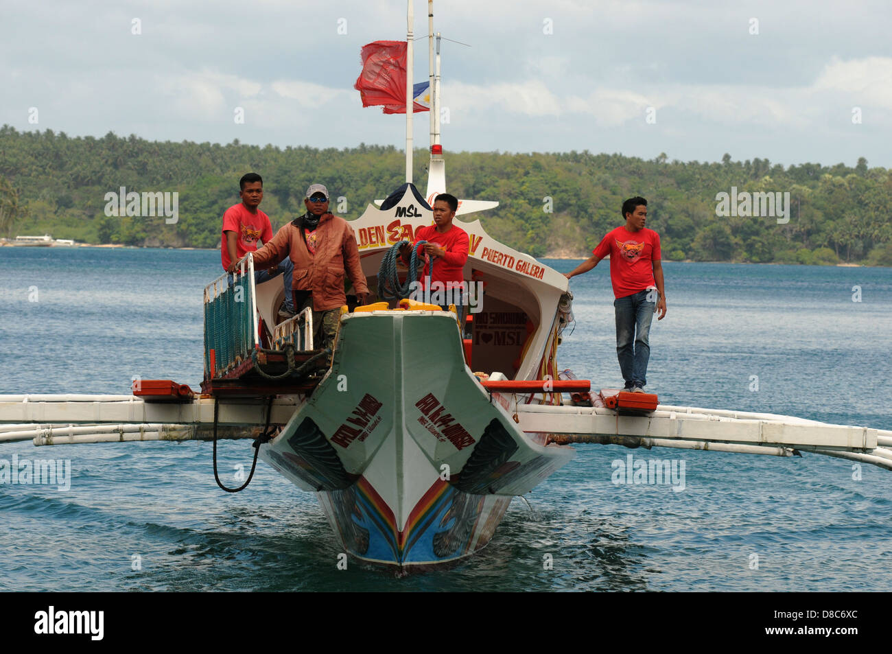 A passenger boat in the port of Puerto Galera. Mindoro Island ...