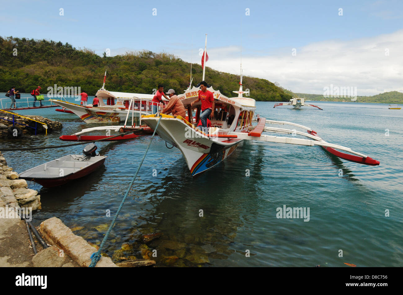 Passenger boats in the port of Puerto Galera. Mindoro Island ...
