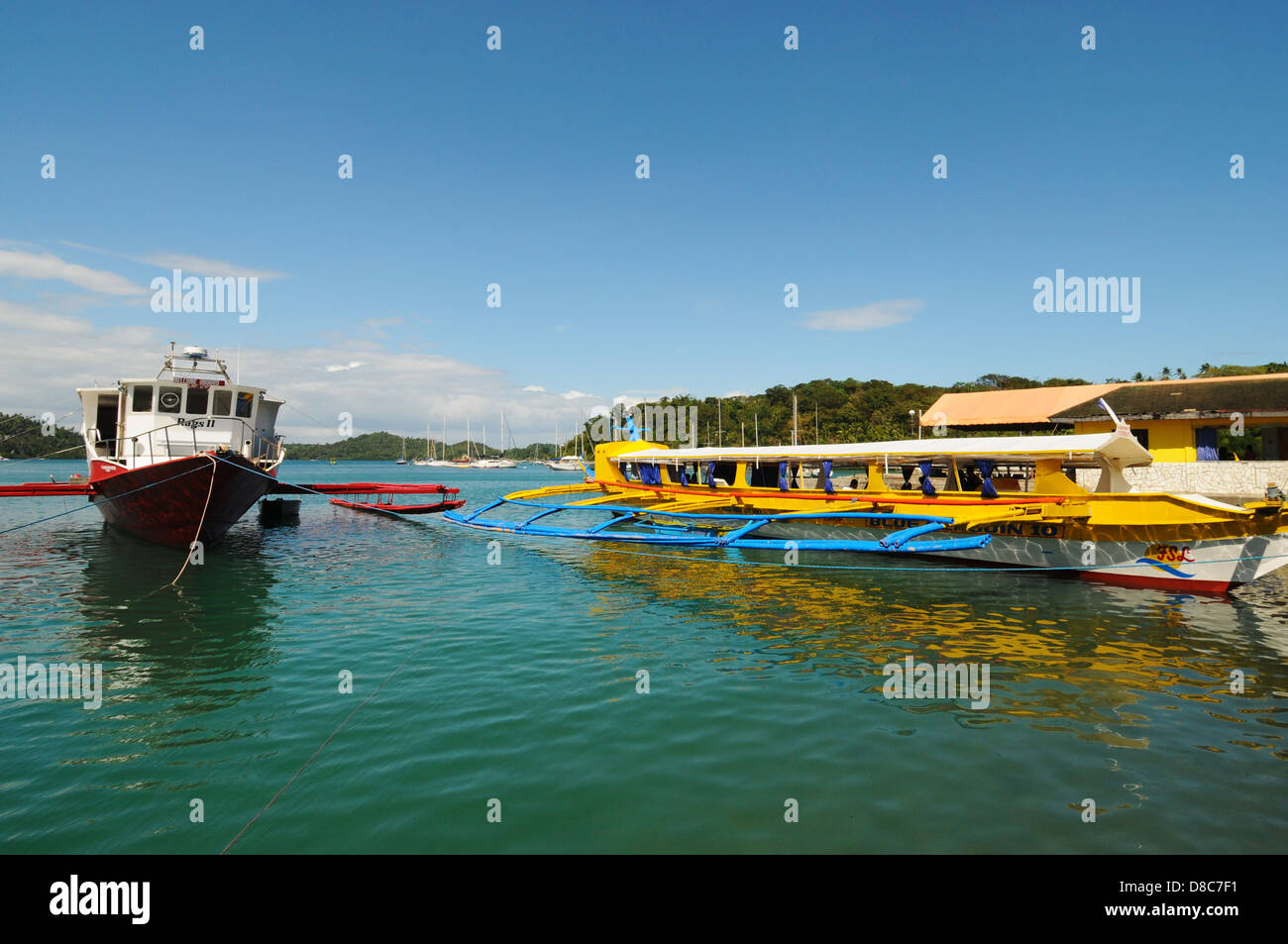 Passenger boats in the port of Puerto Galera. Mindoro Island ...