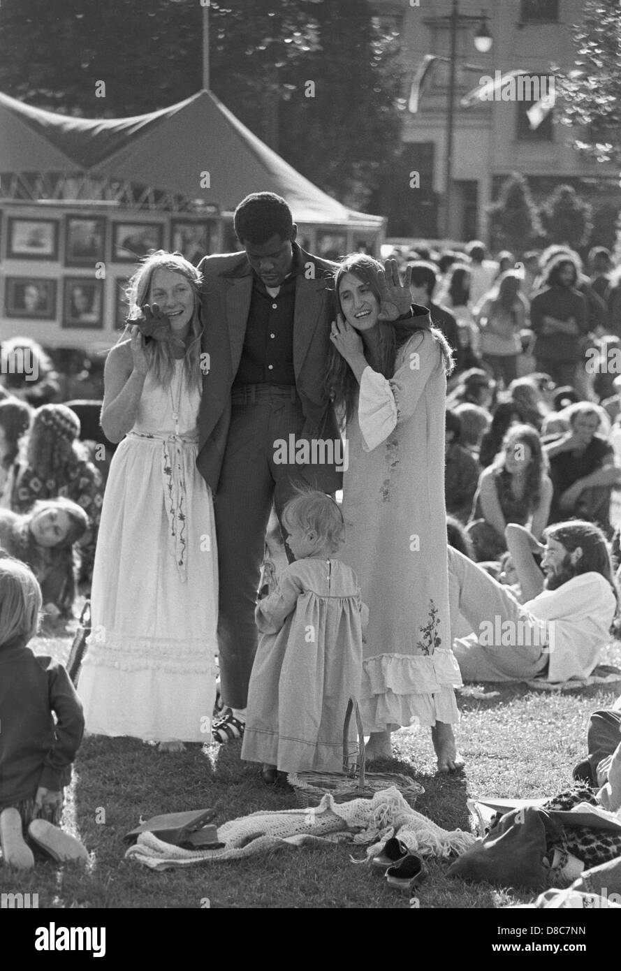 hippies and concert fans dance and party at sixties art and rock music ...